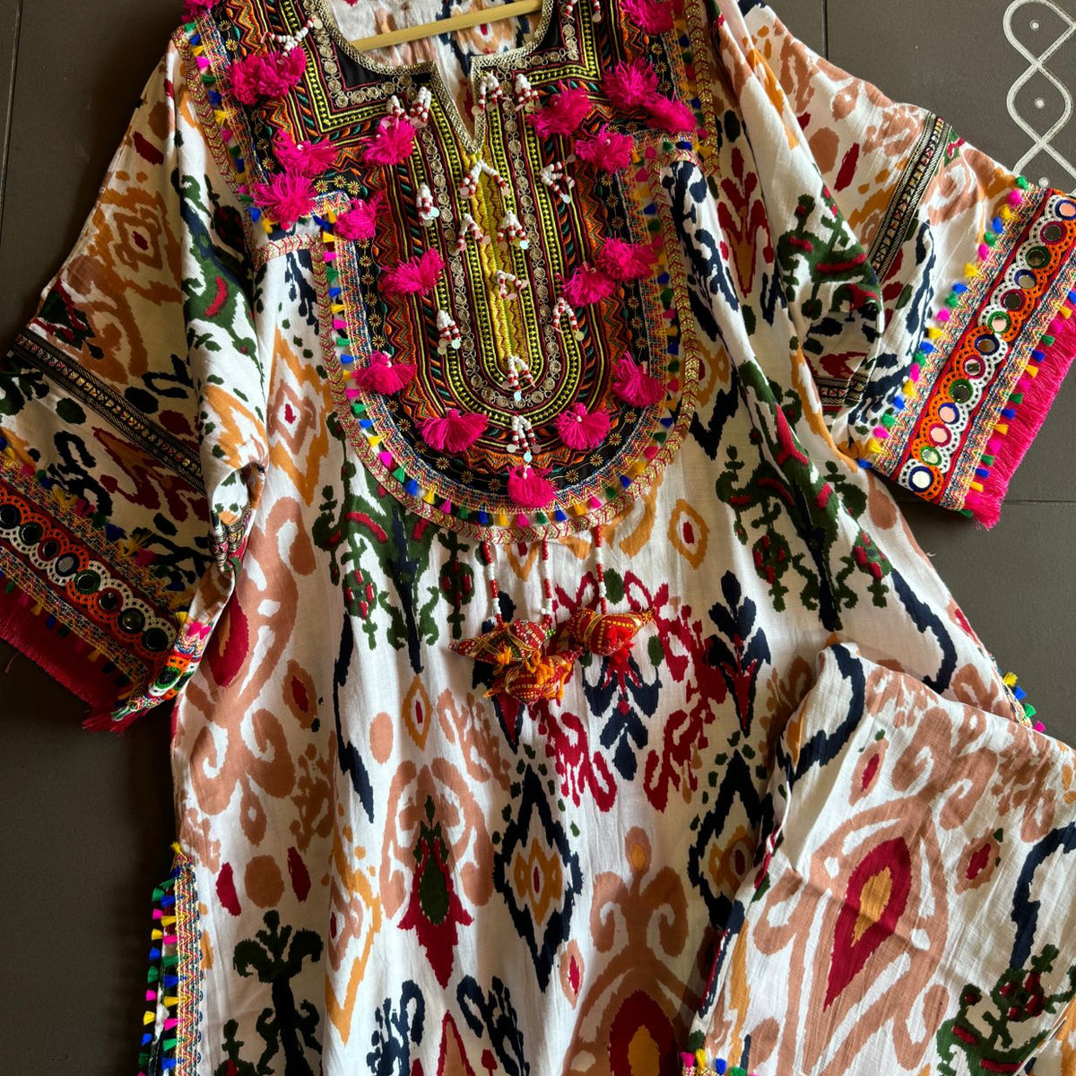 Cotton linen Ikkat printed kurta with Colourful thread work patch on t ...