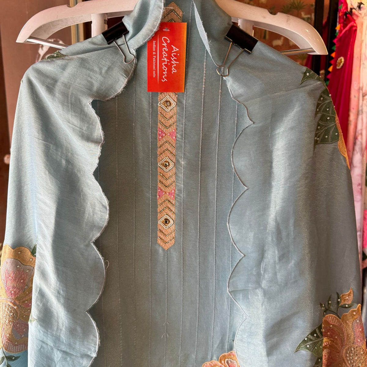 The shirt front has very beautiful floral embroidered boota with pearl ...